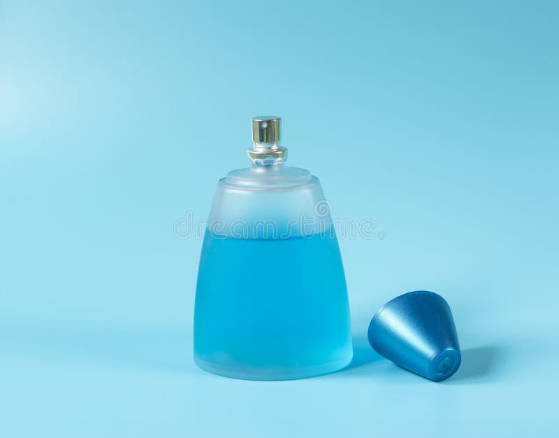 Blue Perfume Bottle on Light Blue Background Stock Image - Image of ...