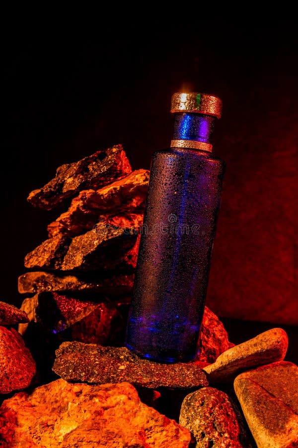 Blue Glass Perfume Bottle on Black Background Stock Photo - Image of ...