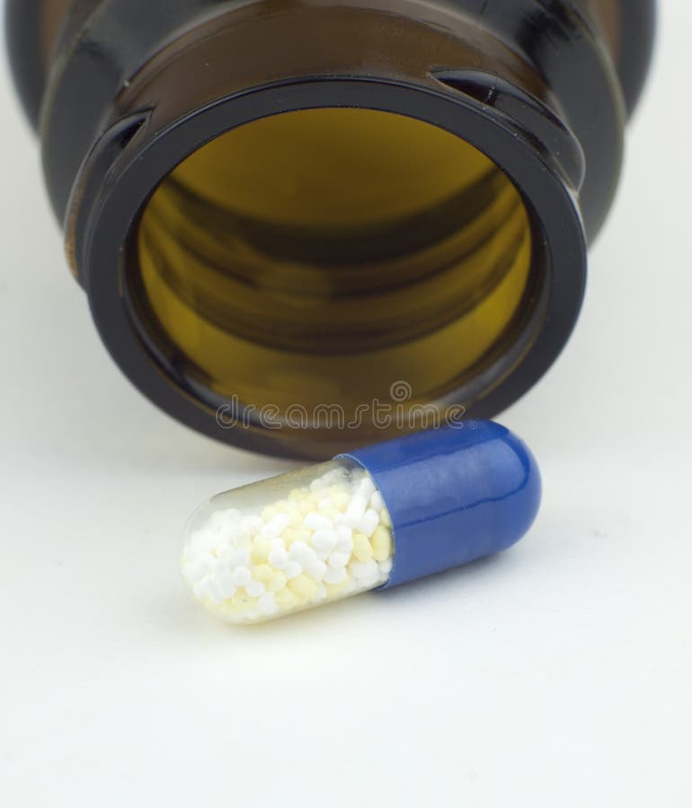 Blue Pill Falling from a Container Stock Image - Image of blue, closeup ...