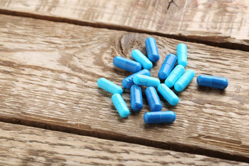 Blue pills capsule stock photo. Image of healthcare - 100073258