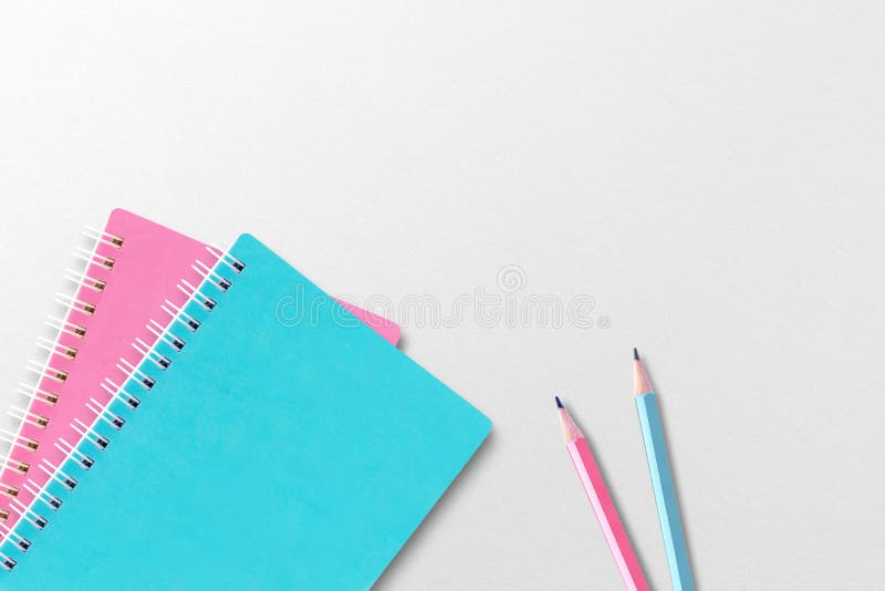 Blue and Pink Notebooks Placed on White Paper. Two Pencils Stock Photo ...