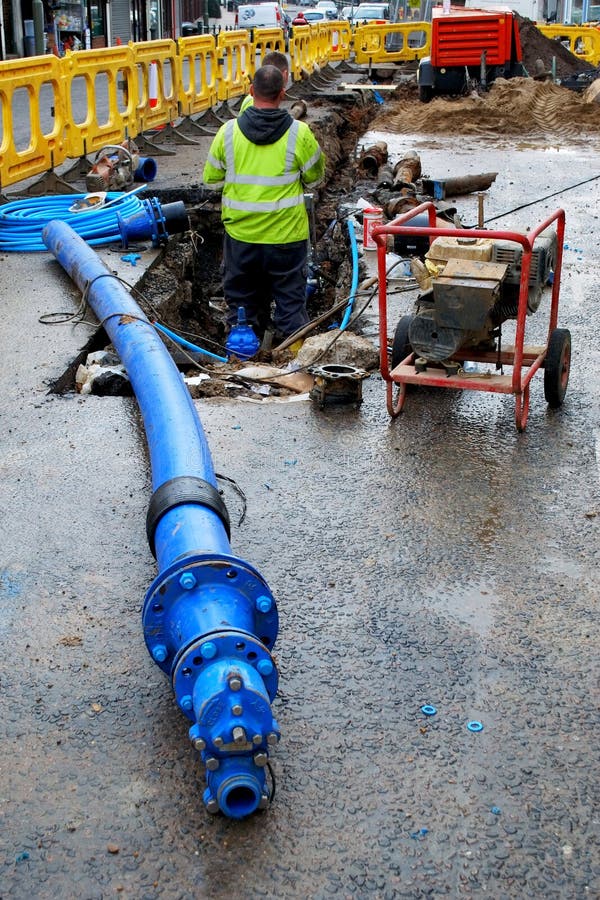 Laying Gas- and Water Pipes Stock Image - Image of cables, operators ...