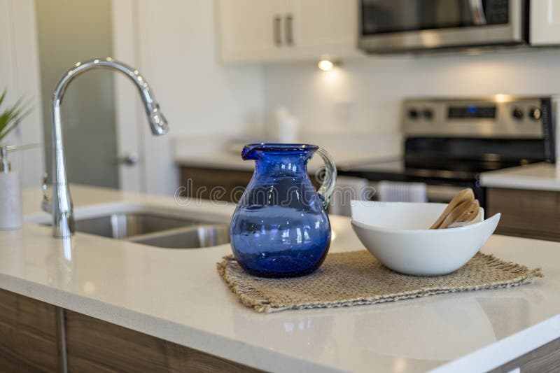 A Blue Pitcher and a White Bowl are on a Counter in a Kitchen Stock ...