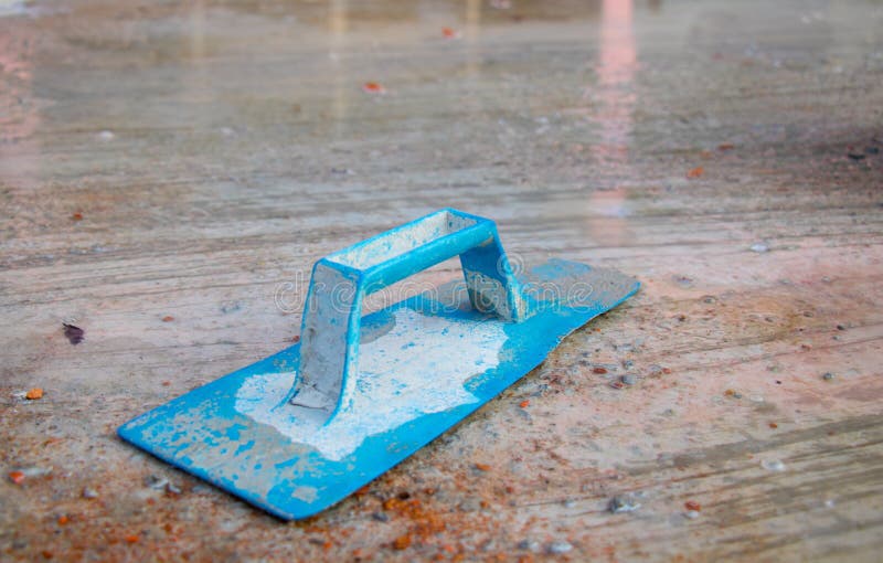 Blue Plasterer at Work. Application of the Plaster on the Cement Wall ...