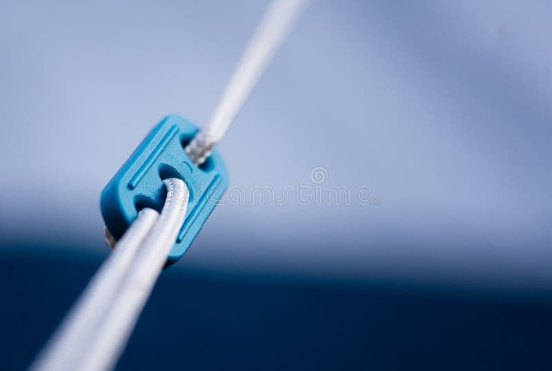 Blue Plastic Adjuster of a Guy Rope for a Tent Stock Photo - Image of ...