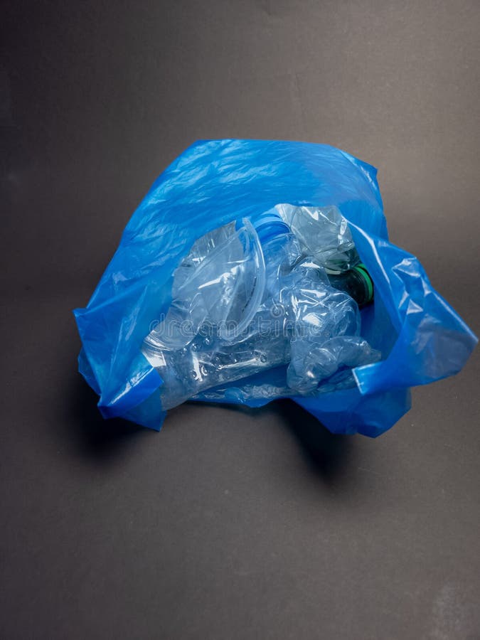 Blue Plastic Bag Overflowing with Discarded Plastic Bottles and Waste ...