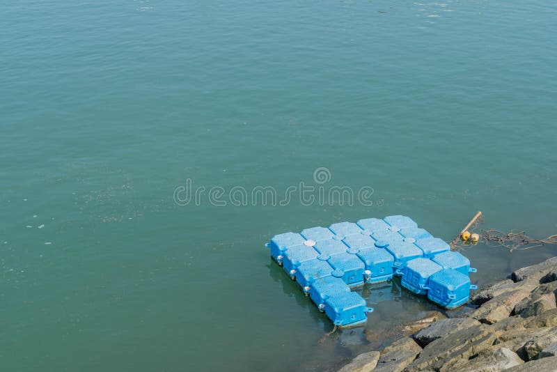 Blue Plastic Blocks Assembled into Small Floating Dock Stock Photo ...