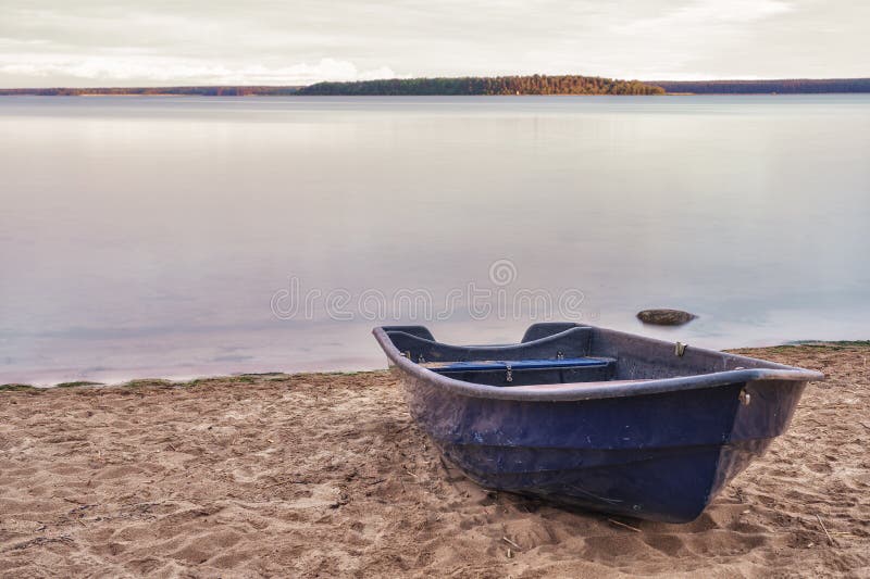 Blue Plastic Boat on the Sandy Beach of the Lake Stock Photo - Image of ...