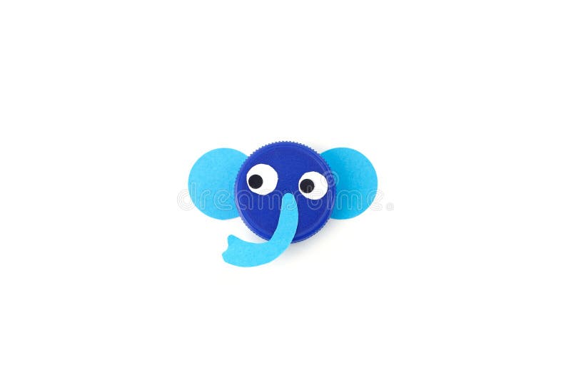Blue Plastic Bottle Cap Transformed into Elephant Face with Paper Ears ...
