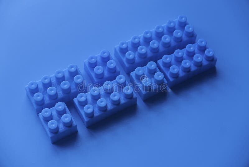 Blue Plastic Building Blocks on Blue Background Stock Photo - Image of ...