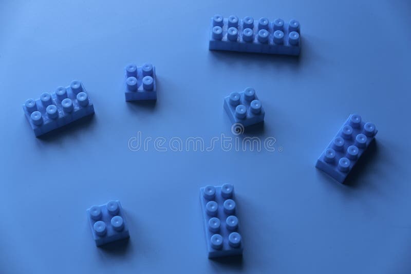 Blue Plastic Building Blocks on Blue Background Stock Photo - Image of ...