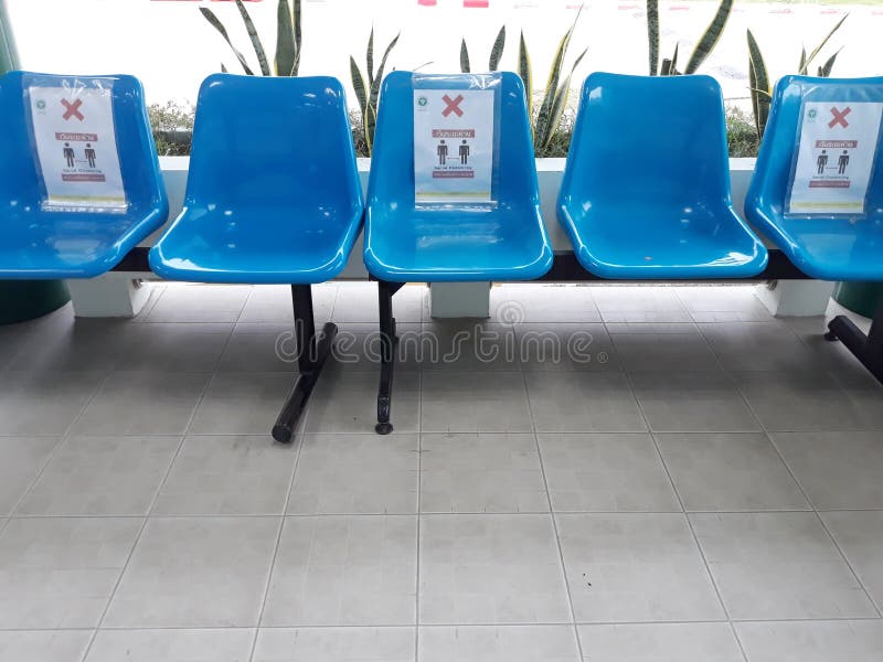 Blue Plastic Chairs are Marked To Sit Apart To Prevent COVID-19. Stock ...