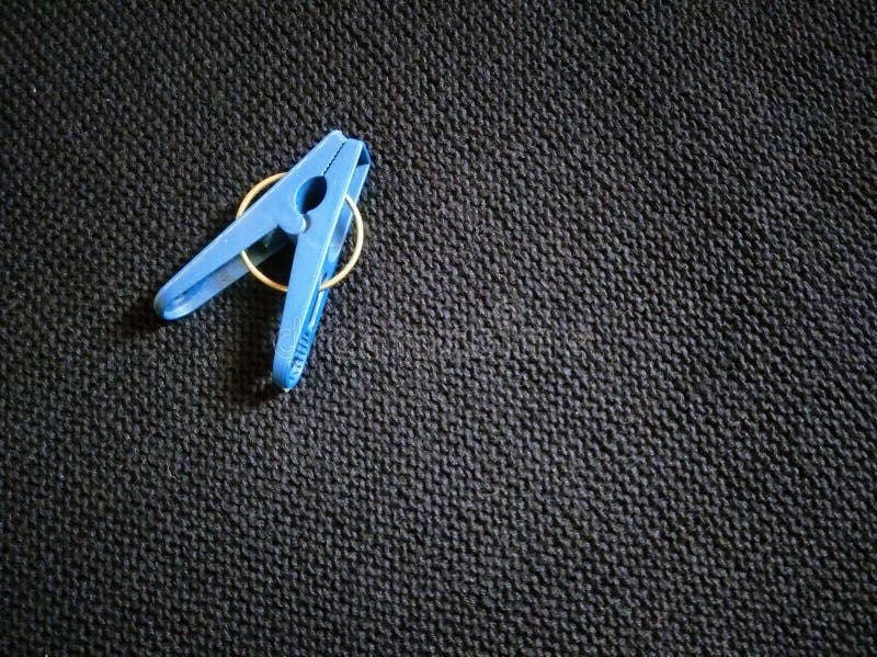 Blue Plastic Clothes Pegs by Black Background Stock Photo - Image of ...