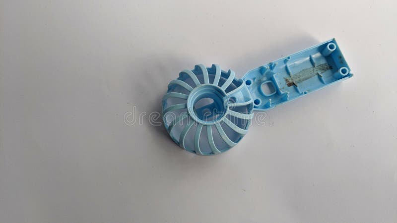 A Blue Plastic Component with a Fan-like Structure. the Component Has a ...