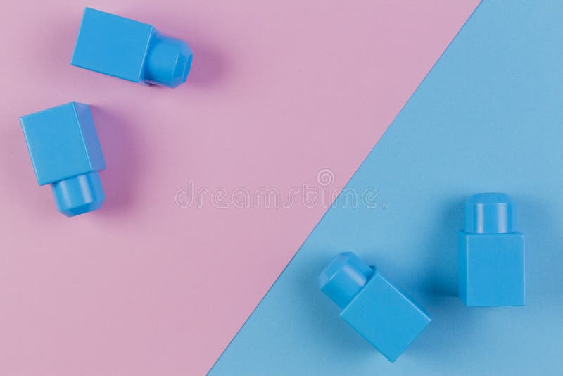 Blue Plastic Construction Blocks on Pink and Blue Background Stock ...