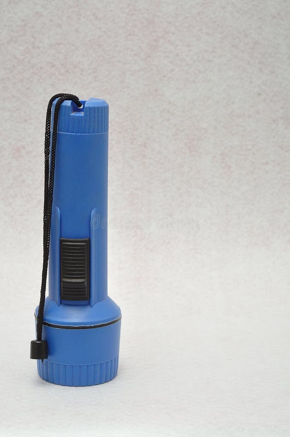 A blue plastic flashlight stock photo. Image of glass - 83245326