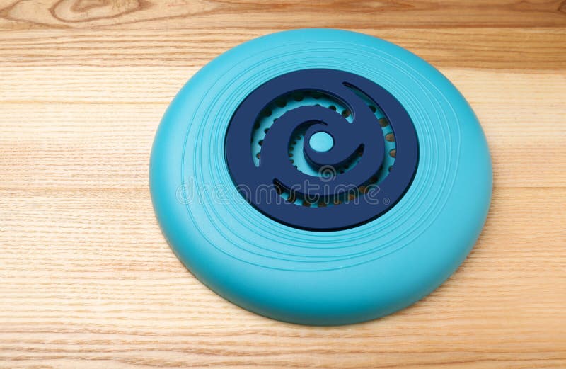 Blue Plastic Frisbee Disk on Wooden Background Stock Image - Image of ...