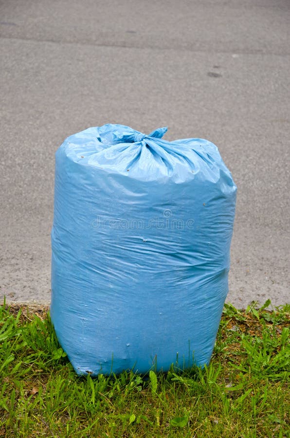 Blue Plastic Garbage Bag on Street Stock Image - Image of package ...