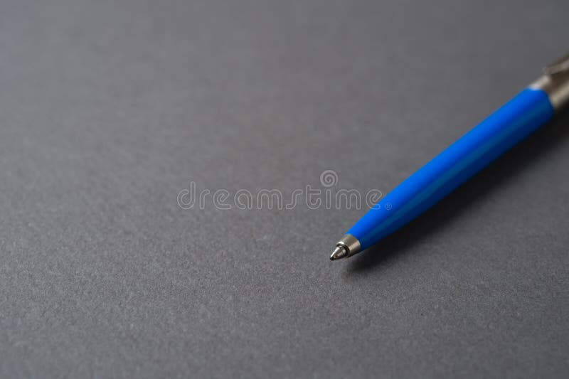 Blue Plastic and Metal Ballpoint Pen on Dark Gray Background Stock ...