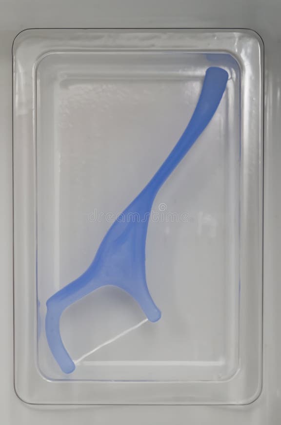 A Blue Plastic Object Resembling a Tool or Device, Placed Inside a ...