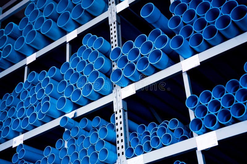 Blue Plastic Pipes in a Stack in a Large Warehouse of a Shopping Center ...