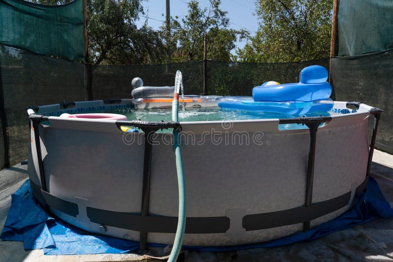 Blue Plastic Pool in the Garden Stock Image - Image of hobby, house ...