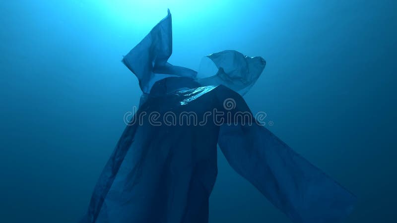 Blue Plastic Raincoat As a Ghost Slowly Float in the Blue Water ...