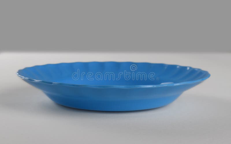 Blue plastic shallow dish stock photo. Image of round - 86487054