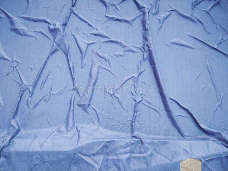The Blue Plastic Sheet on the Car for Dust and Rain Protection. Stock ...