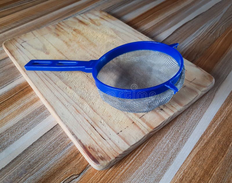 A Blue Plastic Sieve with Silver Mesh Stock Image - Image of instrument ...