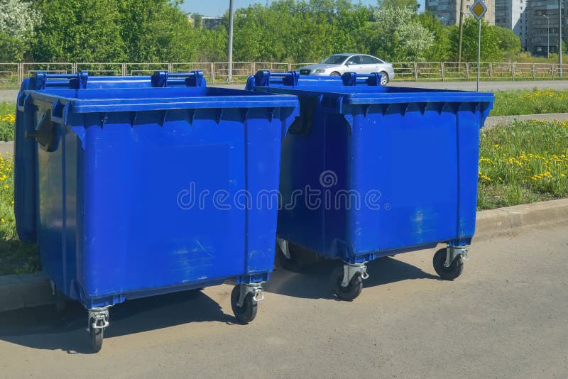 Two Plastic Trash Recycling Containers. Blue Containers for Collecting ...