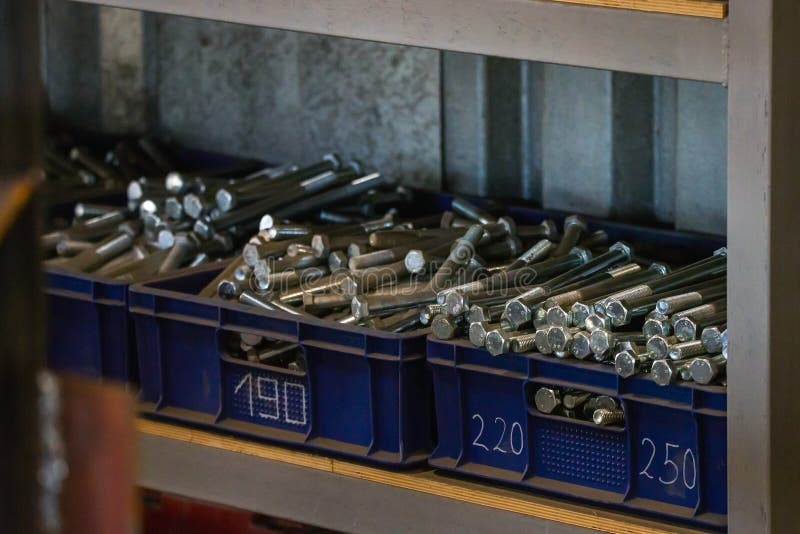 Blue Plastic Tray for Sorting Metal Bolts in Warehouse Stock Photo ...