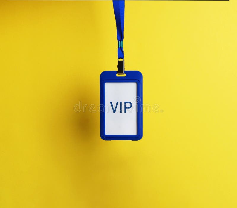 Blue Plastic Vip Badge Hanging on Yellow Background Stock Photo - Image ...