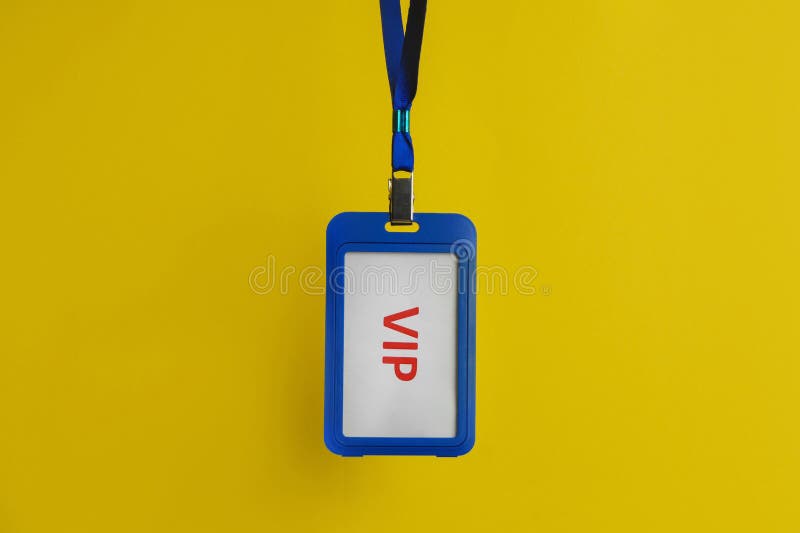 Blue Plastic Vip Badge Hanging on Yellow Background Stock Image - Image ...