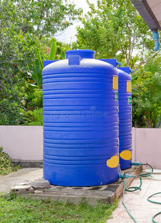 Blue plastic water tanks stock photo. Image of water - 229773362
