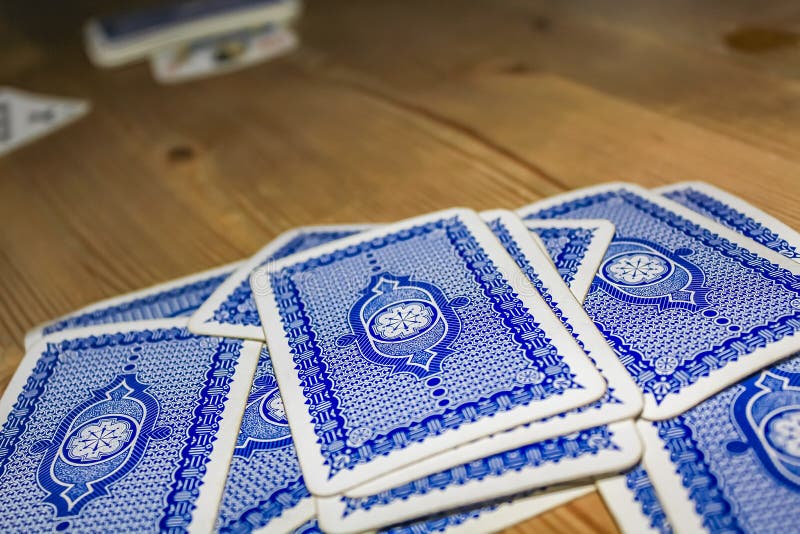 Blue Playing Cards on Wooden Table while Playing Stock Photo - Image of ...