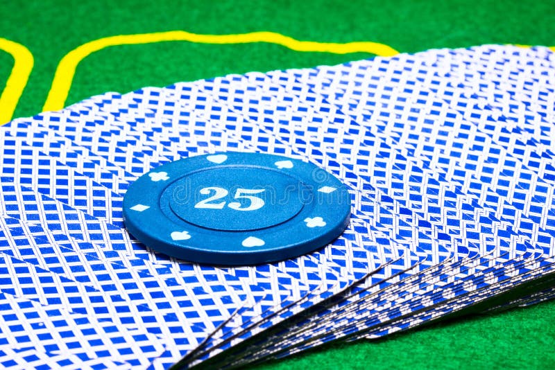 Blue Poker Chip on a Deck of Playing Cards Stock Image - Image of sport ...