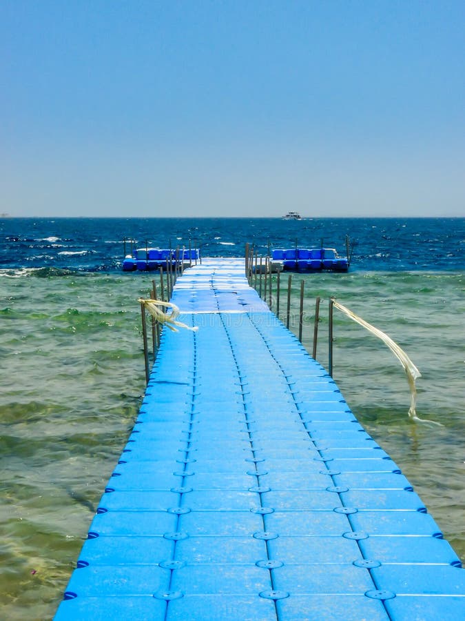Blue pontoon on sea. stock photo. Image of boat, island - 85108534
