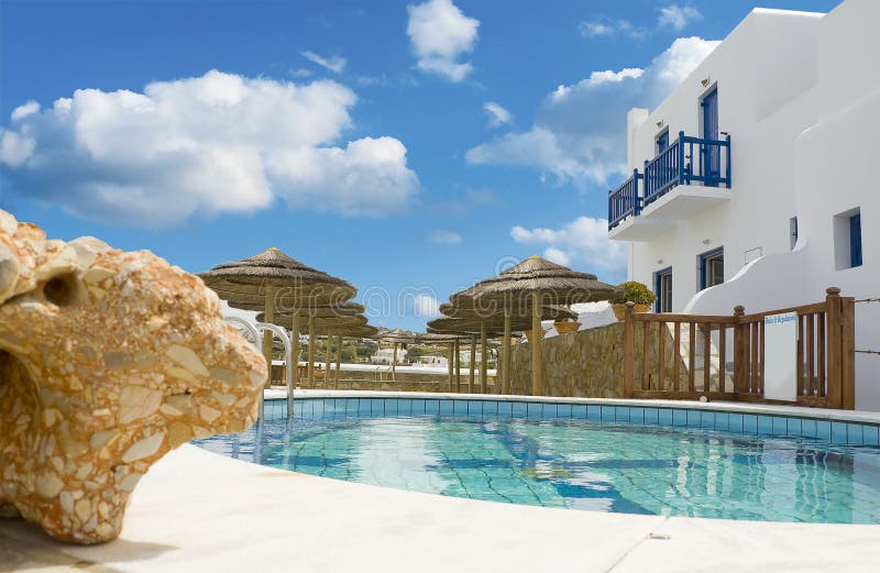 Blue Pool and Umbrellas Around it Near the Hotel Stock Image - Image of ...