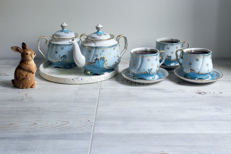 A Blue Porcelain Tea Set on the Table. Teapot and Cups of Tea Stock ...