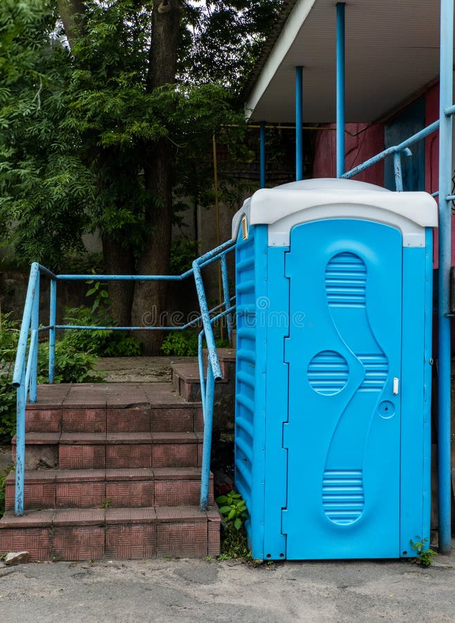 Blue Portable Toilet Standing on the Side of the Building Stock Image ...