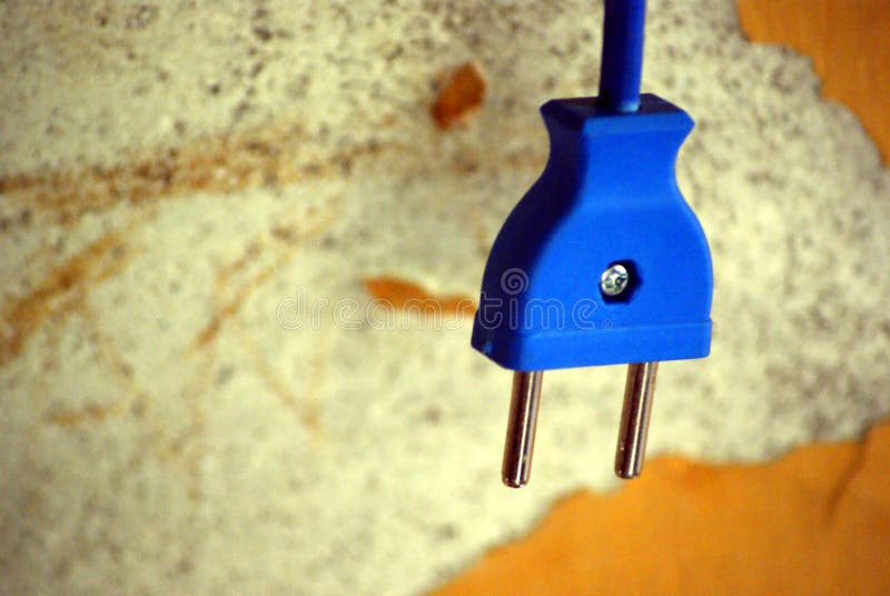 Blue power plug on a wall stock image. Image of wall - 220121079