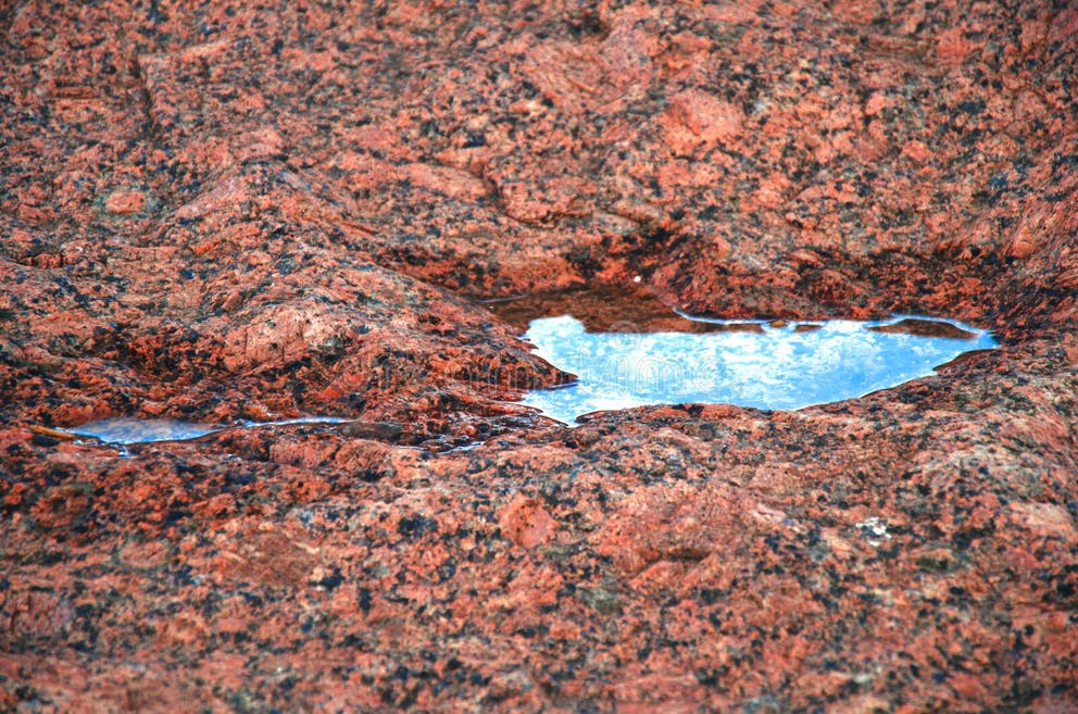 Blue Puddle on the Red Stone. Stock Image - Image of spotted, brown ...