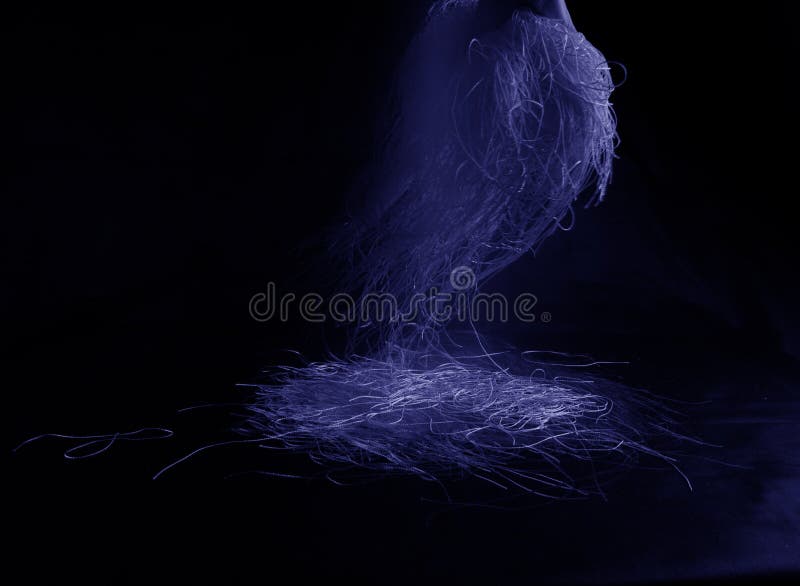Blue, Purple Tangled Threads Hang and Fall on a Black Background ...