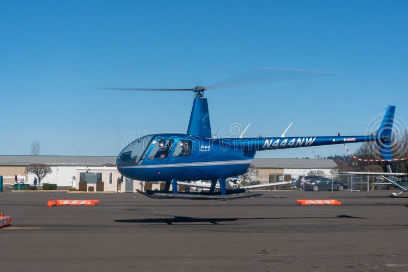 Blue R44 taking off editorial stock photo. Image of motor - 144166063