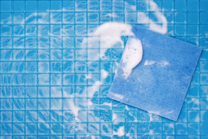 Blue rag in white foam stock photo. Image of surface - 90661914
