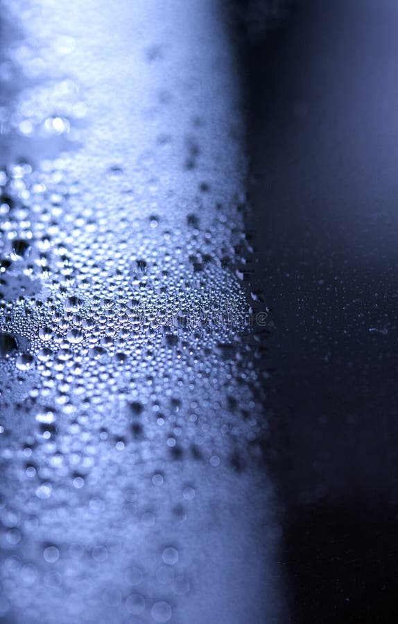 Blue Rain Bubbles Drops Running Down a Window on a Wet Day Abstract ...