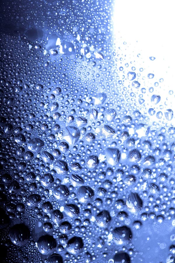 Blue Rain Bubbles Drops Running Down a Window on a Wet Day Abstract ...