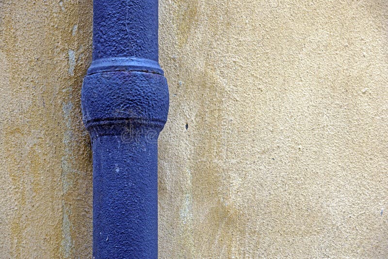 Blue Rainwater Pipe Made of Tin on House Corner Decorative Bricks ...