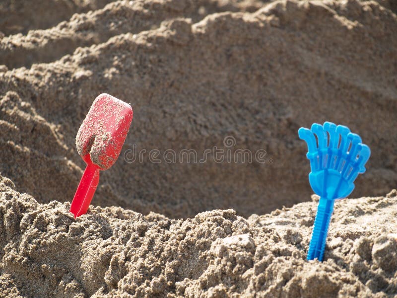 Rake and Shovel crossed II stock photo. Image of sandpit - 17486